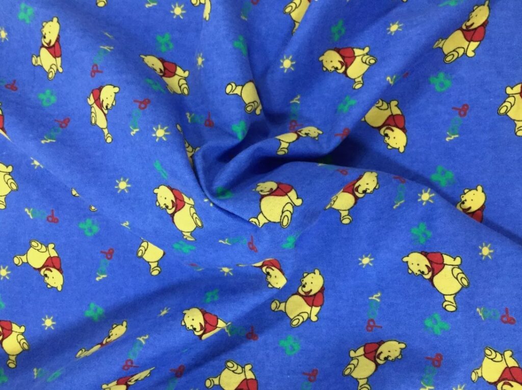 Snuggle Flannel Winnie The Pooh Blue - Thimbles Fabric Shop
